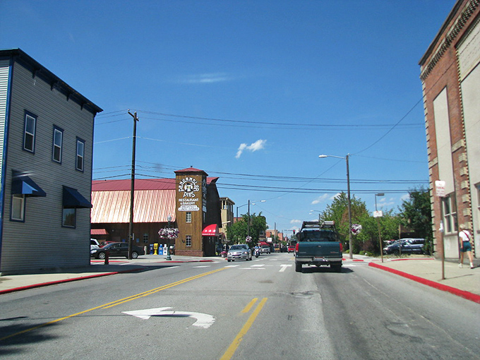 Cars line Sandpoint's welcoming main street where retirement dollars stretch further amid northern Idaho's breathtaking natural beauty.