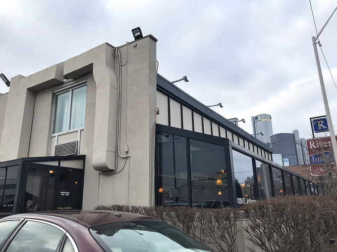 Detroit's skyline peeks through the windows of The Clique, where morning meals come with a side of urban charm.