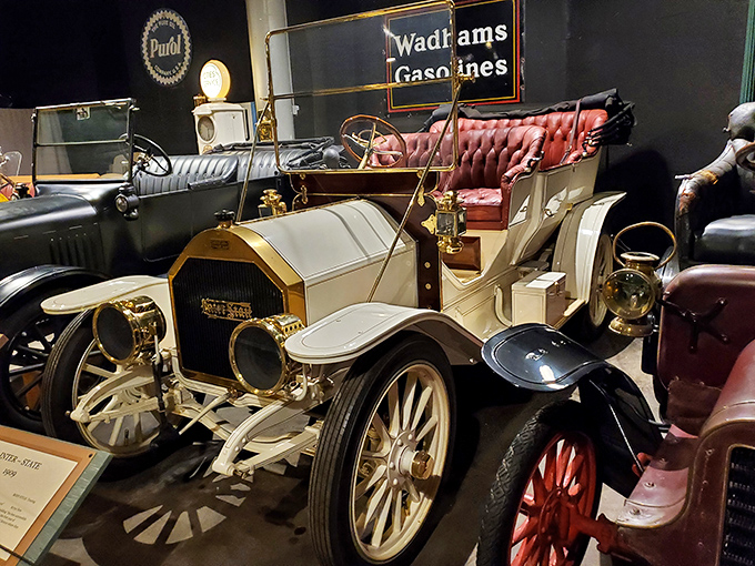 This elegant white 1909 Badger automobile reminds us that luxury travel once meant plush red upholstery and brass accents. The automotive equivalent of a first-class ticket.