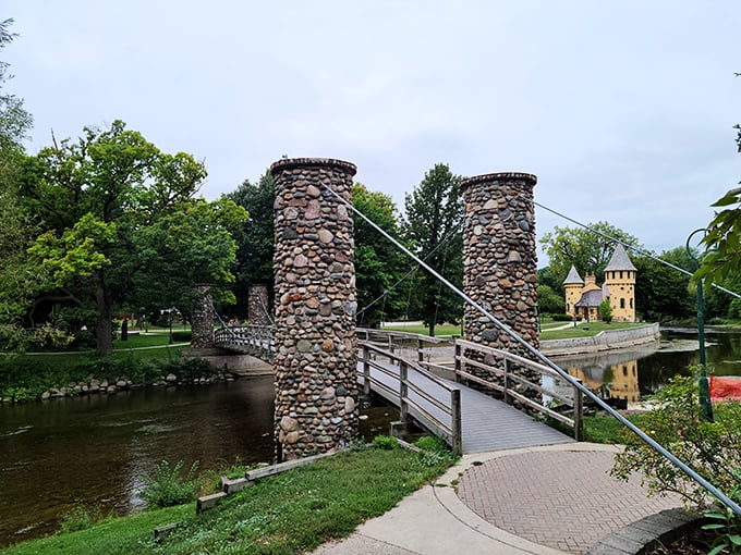 The stone footbridge offers the perfect vantage point for castle-gazing, like a portal between everyday Michigan and a storybook realm.
