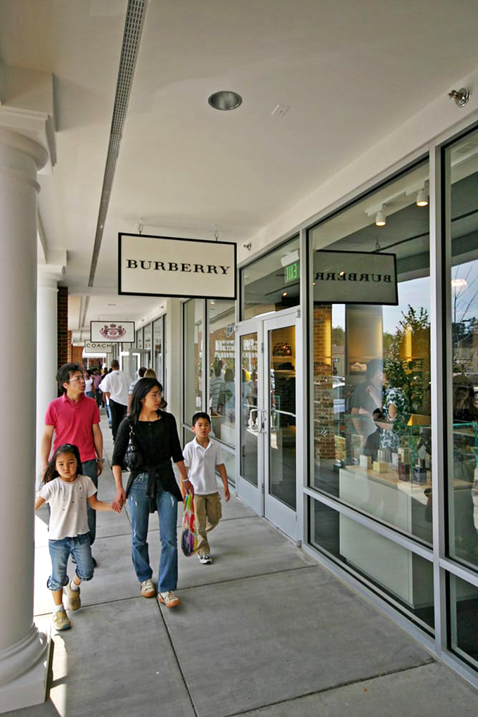 Luxury within reach&mdash;Burberry's iconic signage beckons shoppers into a world where high fashion meets outlet prices.