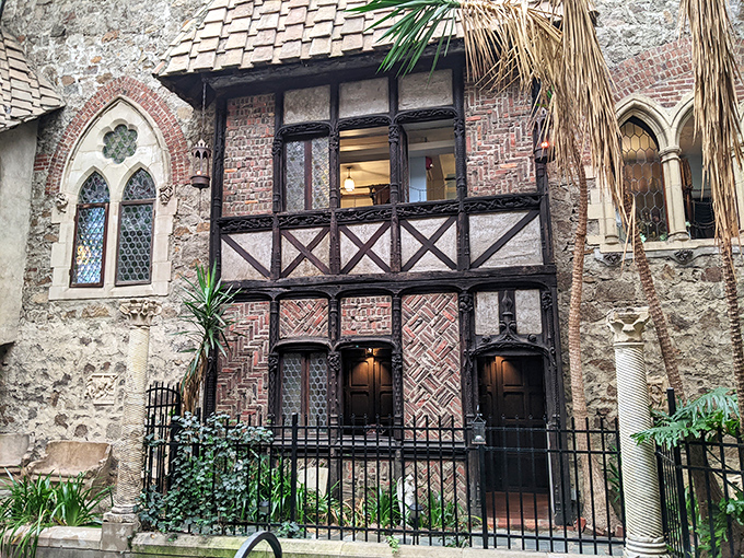 Tudor-style architecture nestled among tropical plants? It's like someone dropped Downton Abbey into a botanical garden and said, "This works!"
