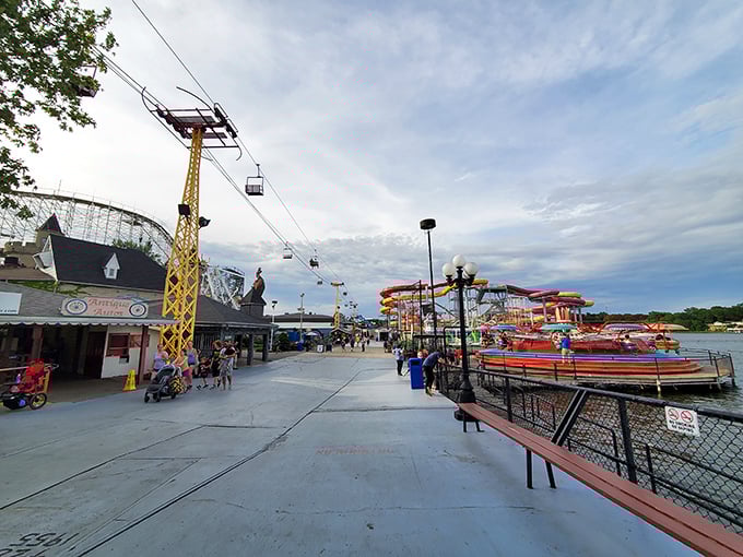 The boardwalk stretches like a promise of adventure, with the skyline's roller coaster silhouette teasing what's to come. Lake Shafer provides the perfect backdrop.