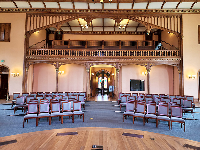 The former House Chamber now hosts events and exhibitions, its ornate woodwork and balcony reminiscent of a Victorian theater.