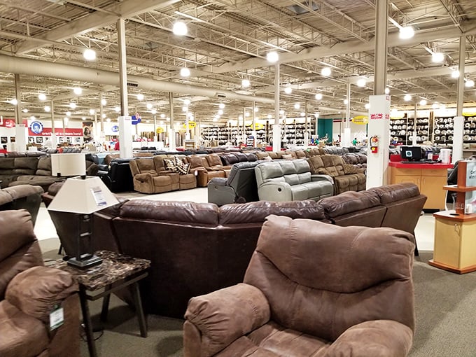 A furniture wonderland stretches before you, where sofas gather in plush herds waiting for their forever homes.