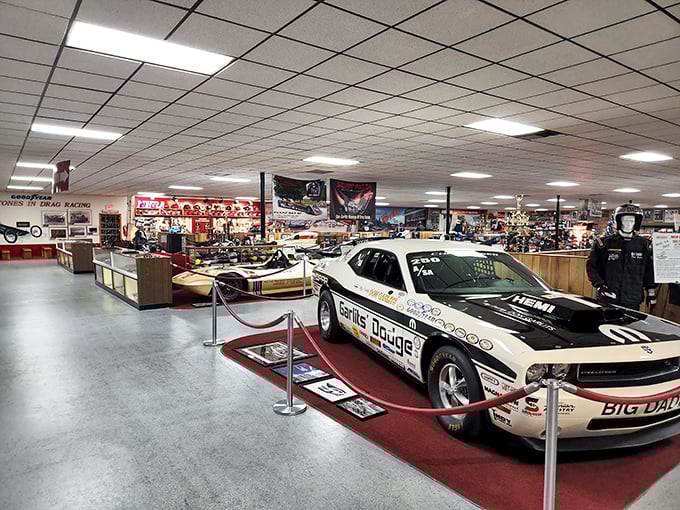 Not your average showroom floor. This dragster collection represents more innovation per square foot than most Silicon Valley startups.