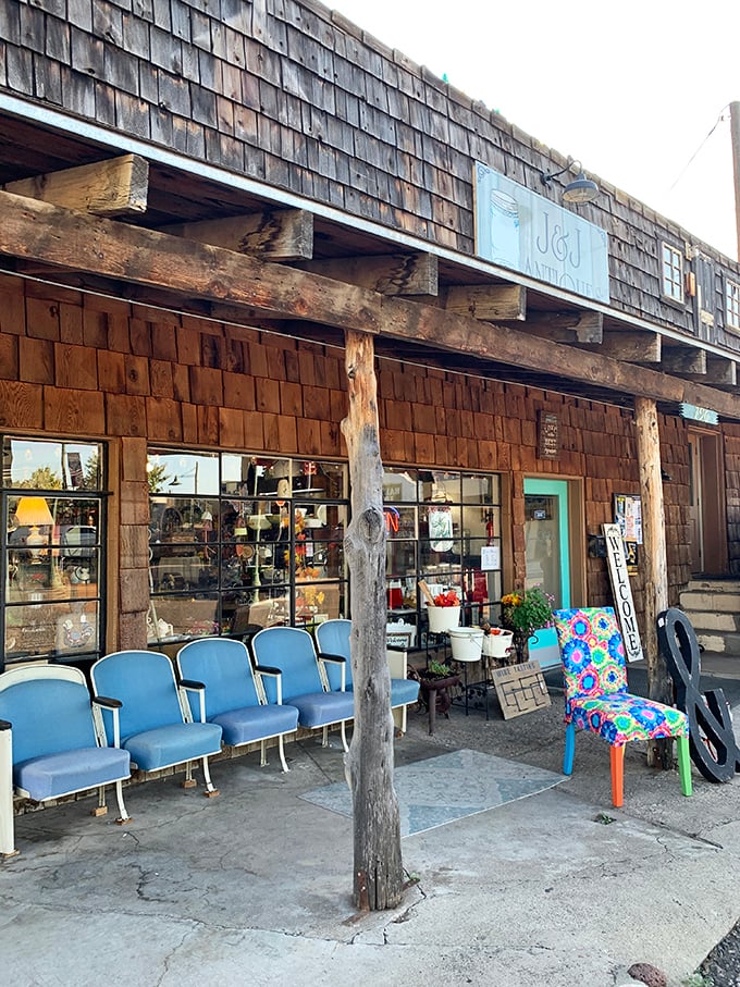 Weathered wood and blue chairs tell stories outside this antique shop &ndash; each piece waiting for someone to give it a second life.