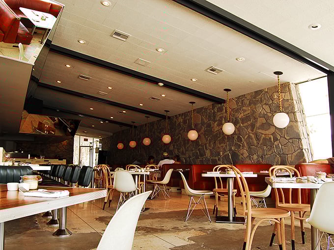 Mid-century modern isn't just in the furniture stores&mdash;it's alive in Palm Springs' diners where Eames chairs and stone walls create time-travel dining experiences.