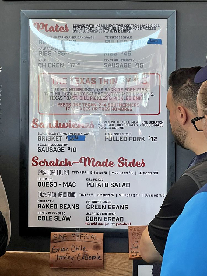 The menu board reads like a love letter to meat lovers, with "The Texas Trinity" promising enough food to feed multiple humans or one very happy Texan.