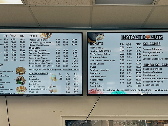 The menu board reads like a sweet-tooth's fever dream, with kolaches and breakfast tacos offering savory respite for those who somehow resist the donuts.
