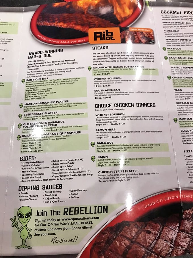 The menu reads like NASA met Memphis barbecue at an intergalactic summit. Those little alien icons marking signature dishes? Culinary flight patterns worth following.