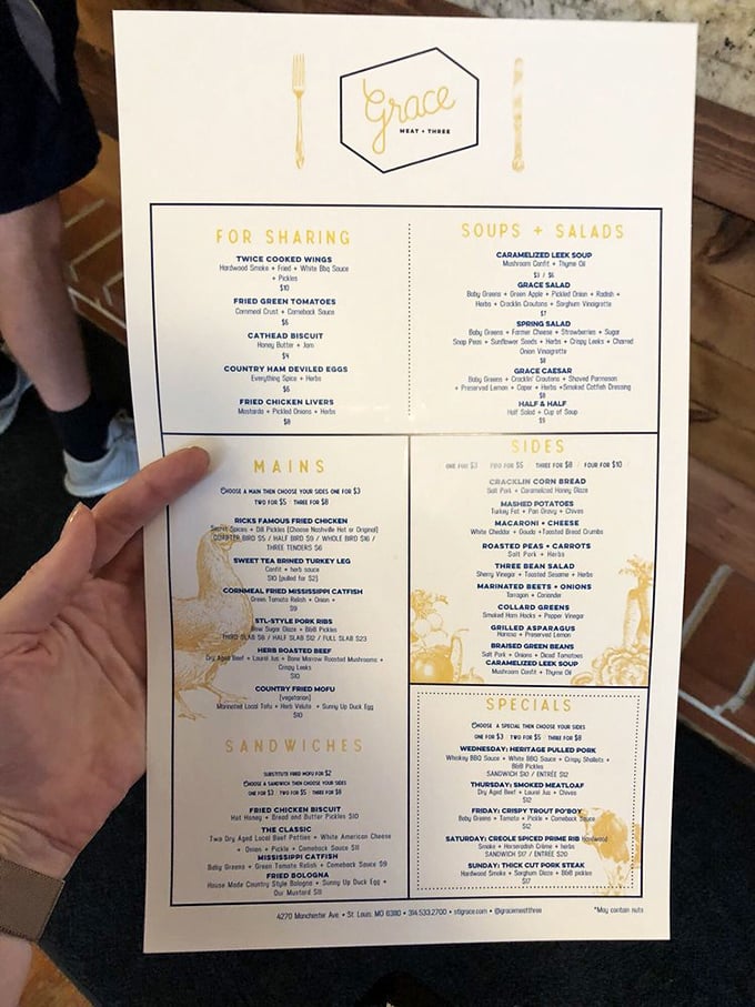 A menu that doesn't just list food but maps out a journey through Southern comfort, where choosing only three sides feels like Sophie's Choice for food lovers.