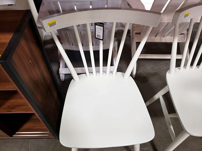 White spindle chairs that whisper "farmhouse chic" without the Joanna Gaines price tag. Your kitchen table's new best friends are waiting.