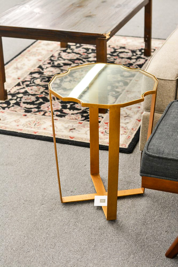 That gold-finished side table? In a Manhattan boutique, it would require a small loan. Here, it's priced like they're doing spring cleaning.