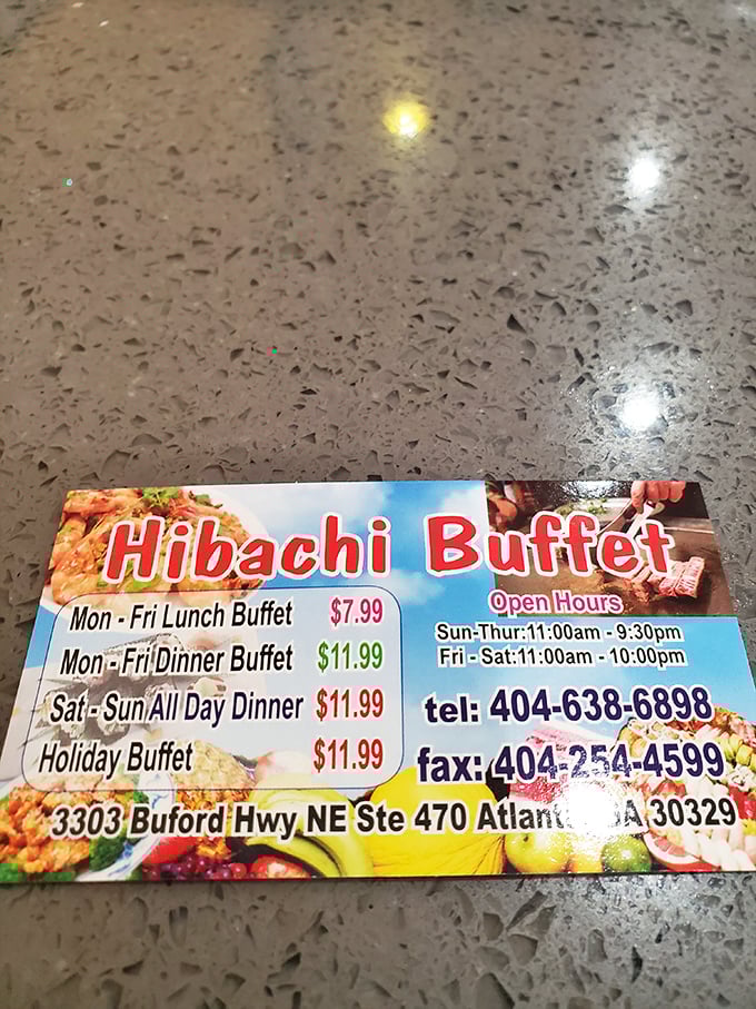 Proof that happiness doesn't have to break the bank: a business card revealing the surprisingly reasonable rates for this culinary marathon on Buford Highway.