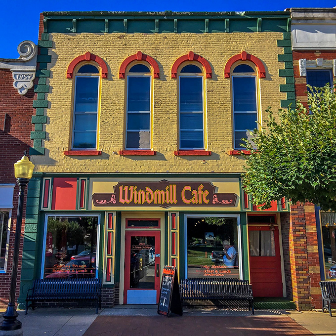 The Windmill Cafe's yellow facade is the architectural equivalent of sunshine&mdash;impossible to pass without smiling. Those arched windows have witnessed countless coffee confessions.