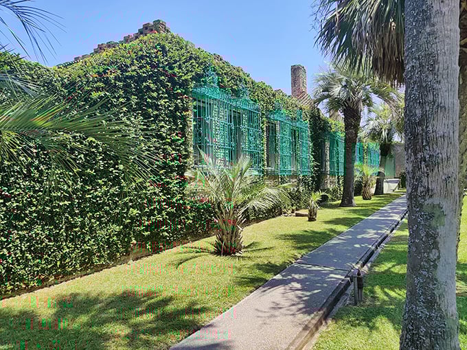 The distinctive green ironwork and climbing vines give Atalaya its unique character&mdash;Spanish Moorish design with a distinctly coastal Carolina twist.