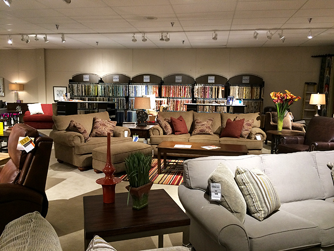 A living room wonderland where fabric swatches create a colorful backdrop for sofas that practically whisper, "Come sit on me, you know you want to."