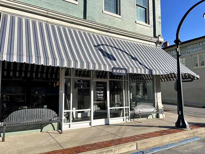 The Bluebird's striped awning isn't just charming decor&mdash;it's practically a beacon signaling "good food and conversation ahead" to weary travelers.