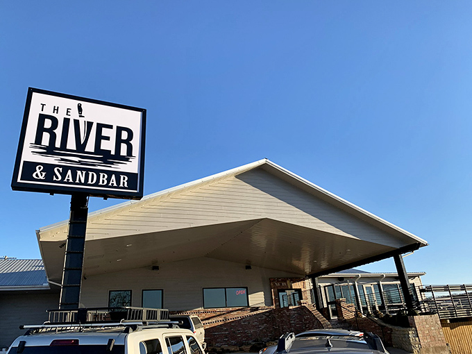 The River & Sandbar isn't just a restaurant&mdash;it's where locals gather to watch the sunset paint the White River while savoring Southern classics with modern flair.
