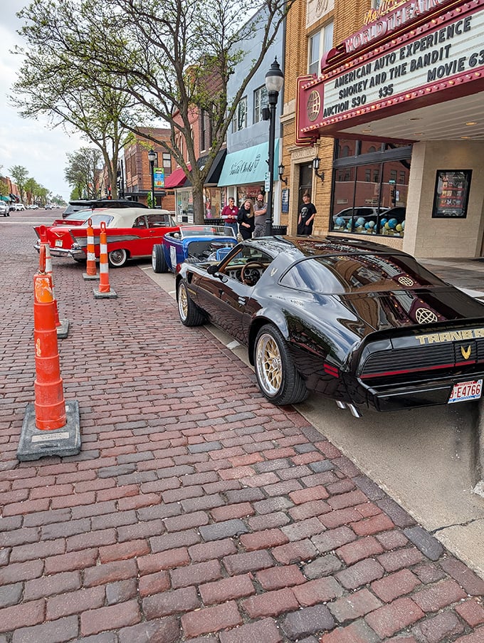 Classic cars line up outside The World Theatre like it's 1955 with Netflix prices. Cultural experiences that won't drain your retirement fund.