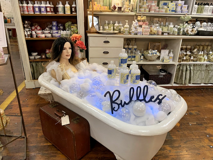 Even mannequins live the bubble bath dream at The Depot, where quirky displays showcase vintage and handcrafted bath products.