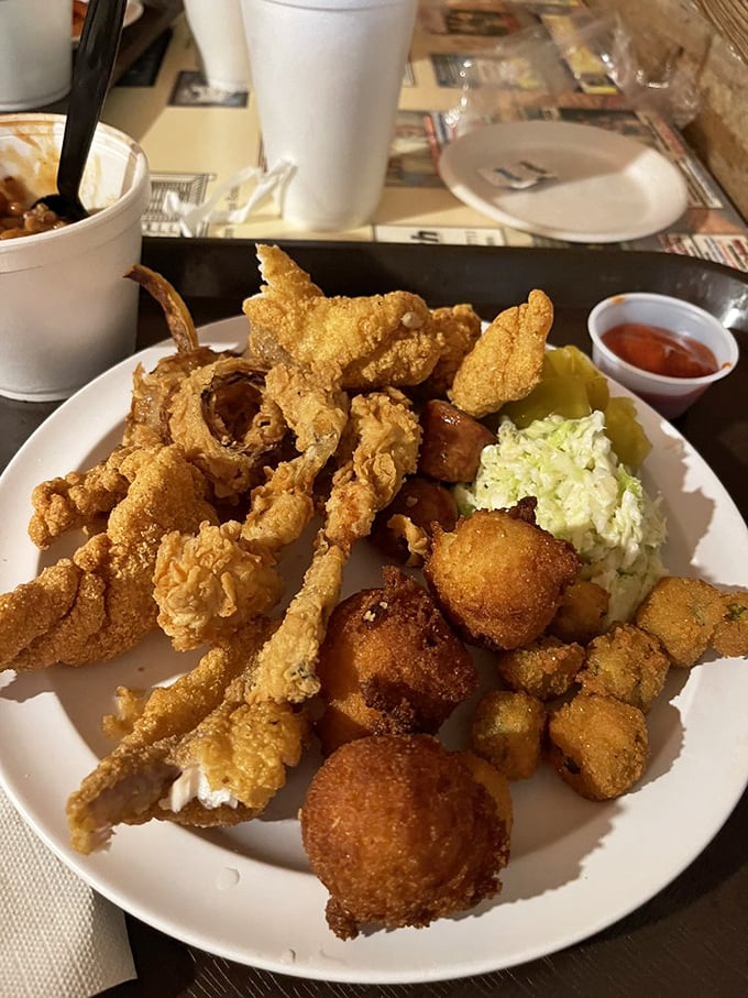 A plate that defies both gravity and diets &ndash; golden fried catfish, hushpuppies, and all the fixings that make cardiologists wince and taste buds dance.