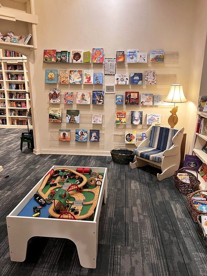 The children's section features a train table and cozy reading chair&mdash;proof that creating the next generation of readers requires both books and play.