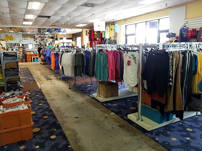 The clothing section stretches into infinity, a kaleidoscope of colors and styles waiting for their second chance at fashion glory.
