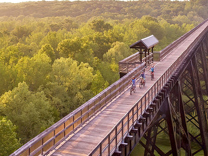 Cyclists glide across this magnificent structure at sunset, proving that sometimes the best views aren't at five-star resorts but 125 feet above a Virginia river.