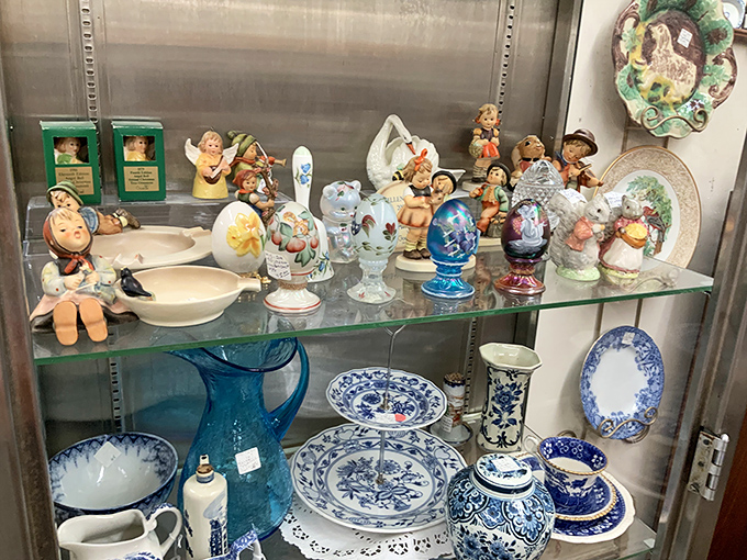Each shelf houses miniature civilizations of collectible figurines. That blue and white china isn't just dinnerware&mdash;it's a portal to Sunday dinners past.
