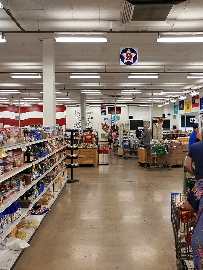 Wide aisles and international flags create a United Nations of discounted groceries. The treasure hunt begins here!