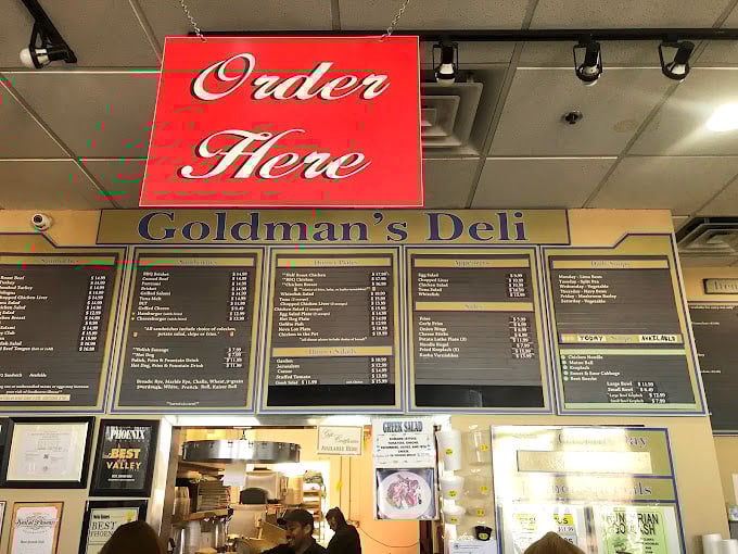 The menu board reads like a love letter to traditional deli fare. Decision paralysis has never been so delicious!