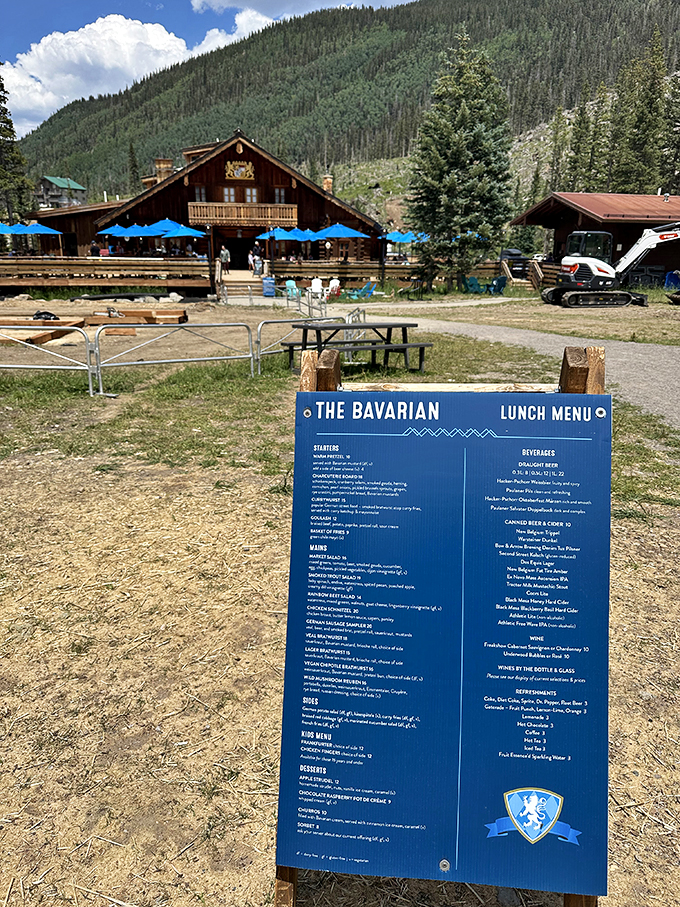 The menu board stands like a culinary treasure map, promising adventures in schnitzel, sp&auml;tzle, and other German delights.