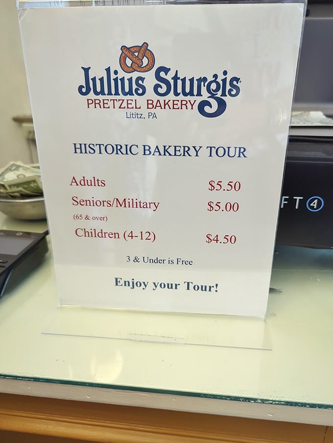 The tour pricing sign reminds us that some of life's most memorable experiences cost less than a fancy coffee. History with a side of carbs!