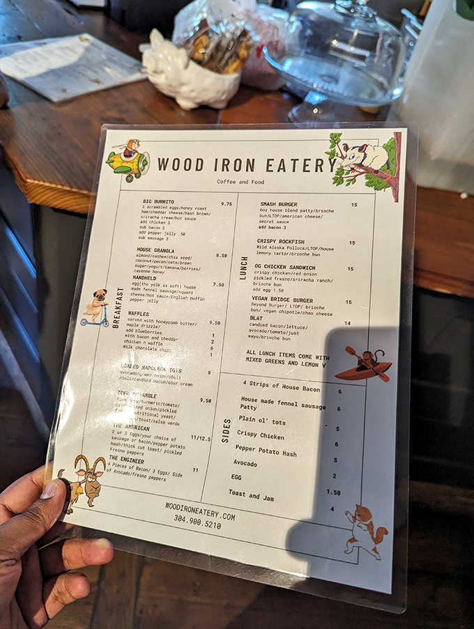 A menu that reads like a love letter to breakfast. Those little illustrated animals in the corners? They know what's about to happen to your taste buds.