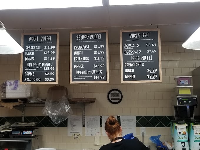 The menu board tells a beautiful story of buffet economics: come hungry, leave happy, and your wallet won't even hold a grudge.