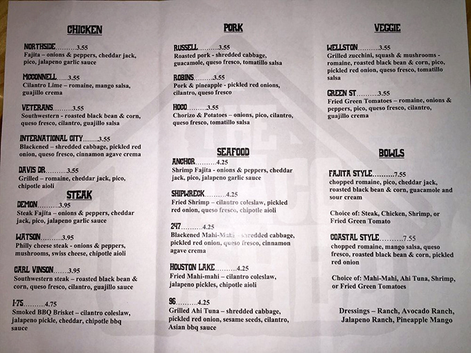 This isn't just a menu; it's a roadmap to happiness. Each taco named after local streets makes choosing feel like a delicious geography lesson.