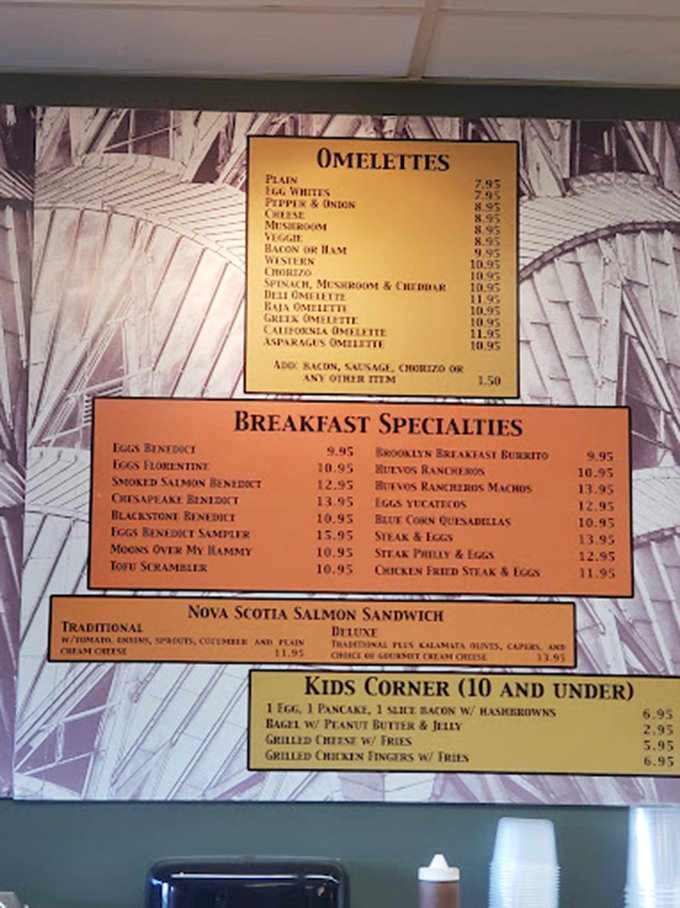 The menu board reads like a love letter to breakfast classics. Those "Moon Over My Hammy" and "Eggs Benedict Sampler" options are calling my name!