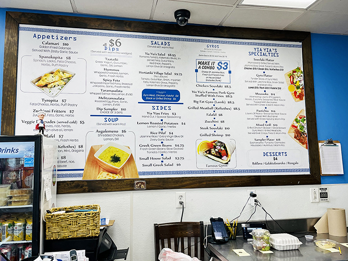 The menu board reads like a love letter to Greek cuisine, offering everything from classic gyros to specialties that would make any YiaYia (grandmother) proud.