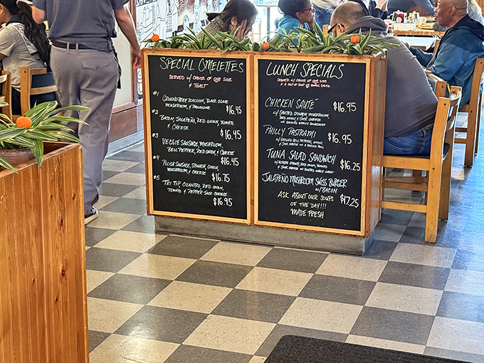 The chalkboard menu reads like a love letter to breakfast classics, with special omelets that make decision-making the hardest part of your day.