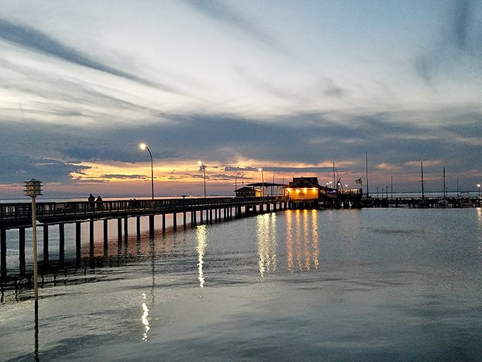 The Fairhope Municipal Pier at sunset is where even the most dedicated phone-addicts put their devices down. Nature's screensaver beats anything Apple can design.