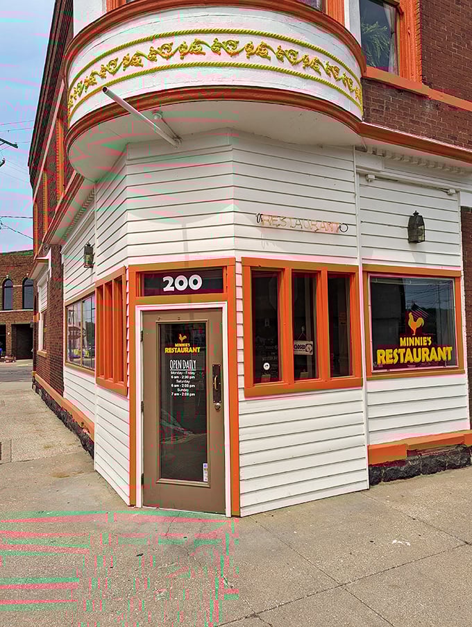 Minnie's Restaurant occupies the corner spot where locals have gathered for decades. That orange trim isn't trying to be trendy&mdash;it's been confidently unfashionable since before hipsters existed.