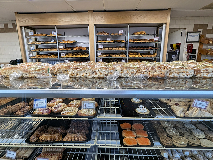 Donut heaven exists, and it has shelves. This display case offers more options than most streaming services&mdash;each one promising a different kind of happiness.