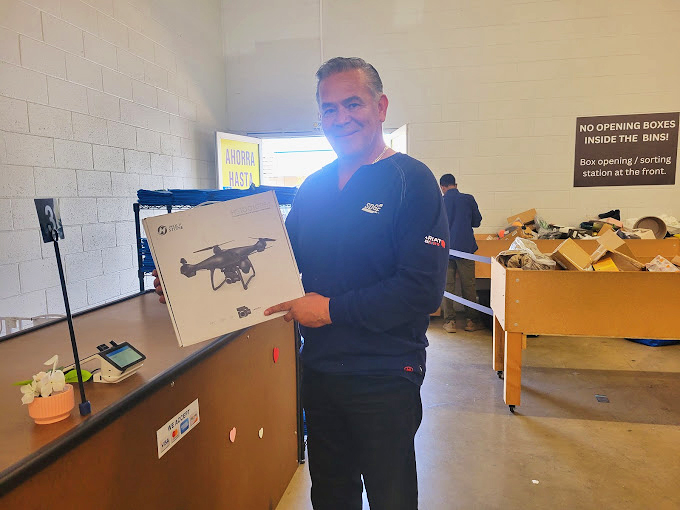 That moment when you score a drone for a fraction of retail. His smile says it all &ndash; part victory, part "wait till my friends hear about this!"