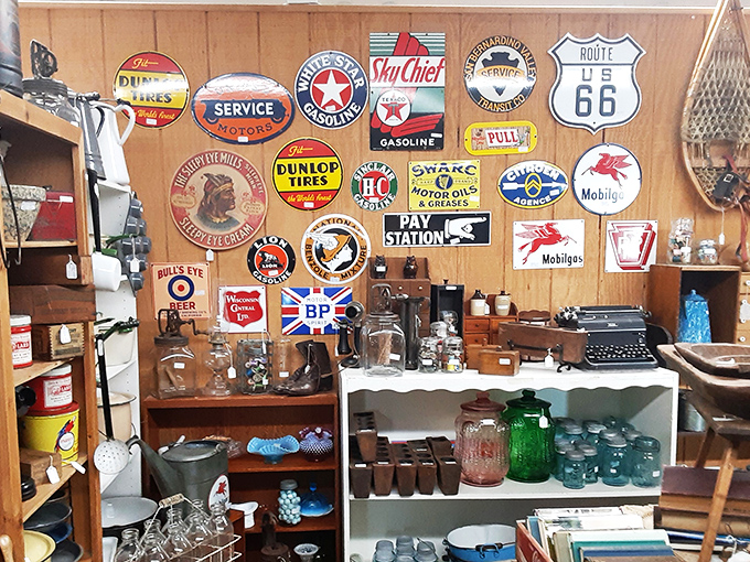 This wall of vintage advertising signs isn't decoration—it's a museum of American road trips and Saturday morning errands that our grandparents ran.