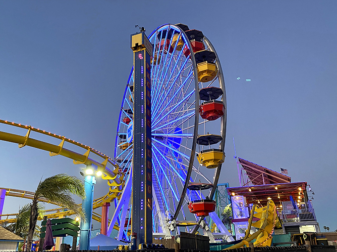As twilight descends, the Pacific Wheel transforms into a mesmerizing light show against the darkening sky&mdash;proof that Ferris wheels are nature's way of saying "slow down and enjoy the view."