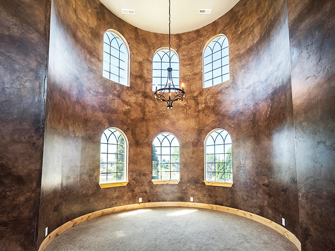 This circular tower room with its arched windows and wrought-iron chandelier feels like stepping into a scene from "Game of Thrones"&mdash;minus the impending doom.