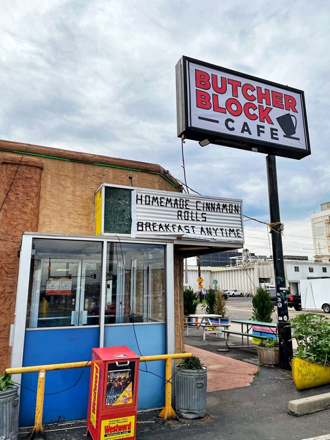 Butcher Block Caf&eacute;'s sign promises "HOMEMADE CINNAMON ROLLS" with the confidence of someone who knows they've mastered breakfast.