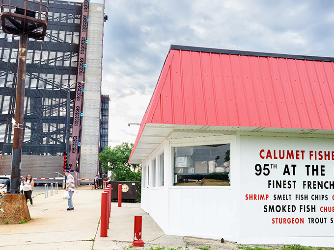 Calumet Fisheries stands like a seafood sentinel with its bright red roof. This tiny shack by the bridge has been smoking fish to perfection forever.